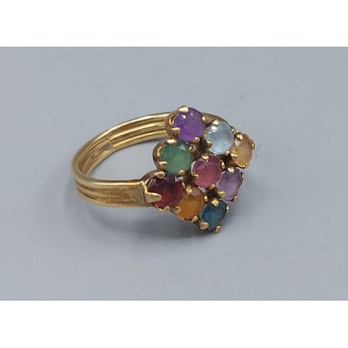 A yellow metal multi stone set ring, ring size L, 3.2gms