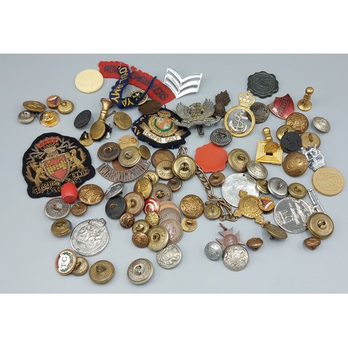 A collection of military badges and button