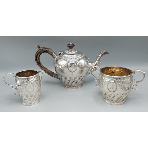 A Victorian three piece tea service, comprising of teapot, cream jug ...