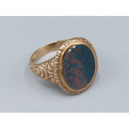 A 9ct gold stone set Signet ring of oval form, 8.6gms, ring size S