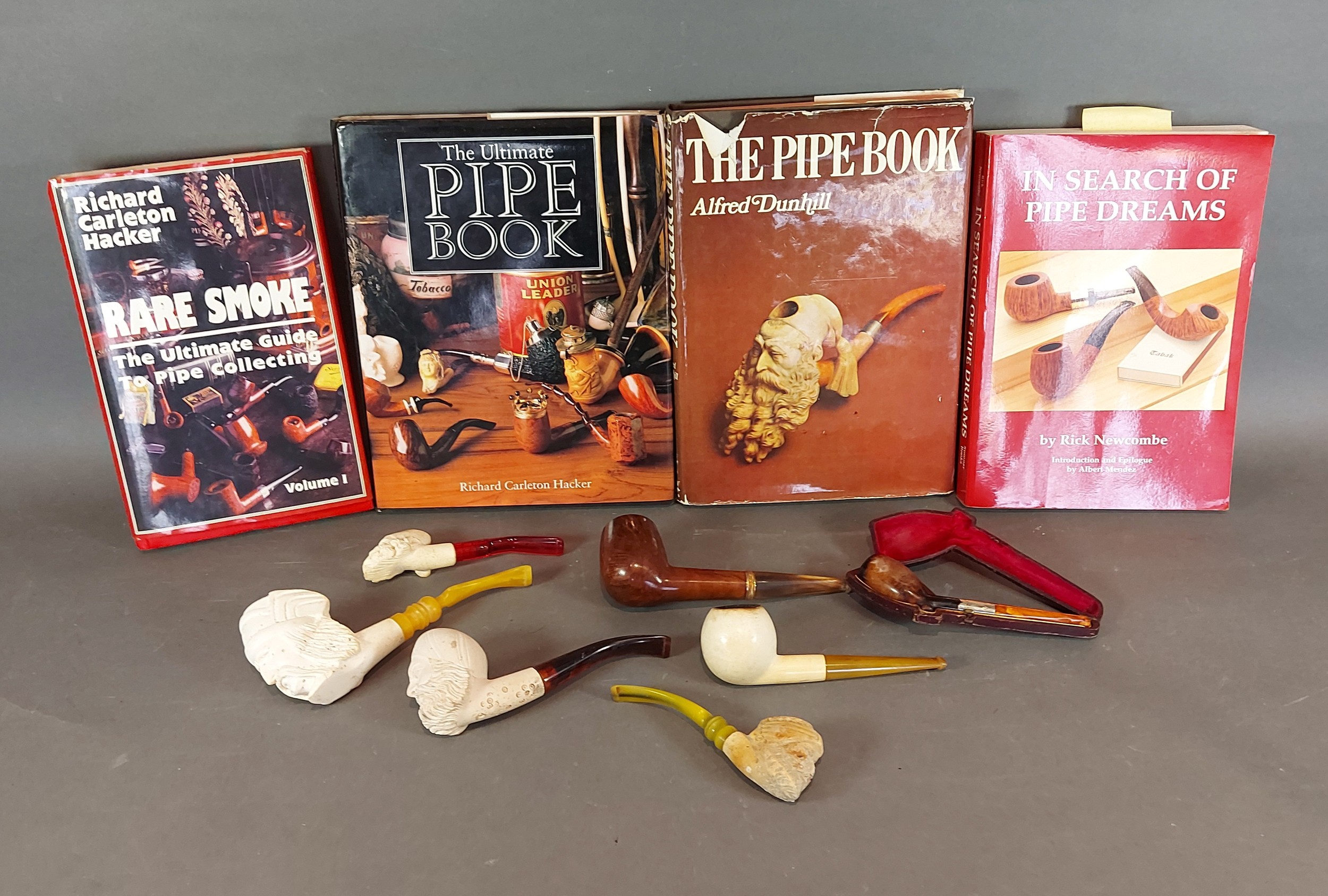 Four carved Meerschaum pipes together with three other pipes and four ...