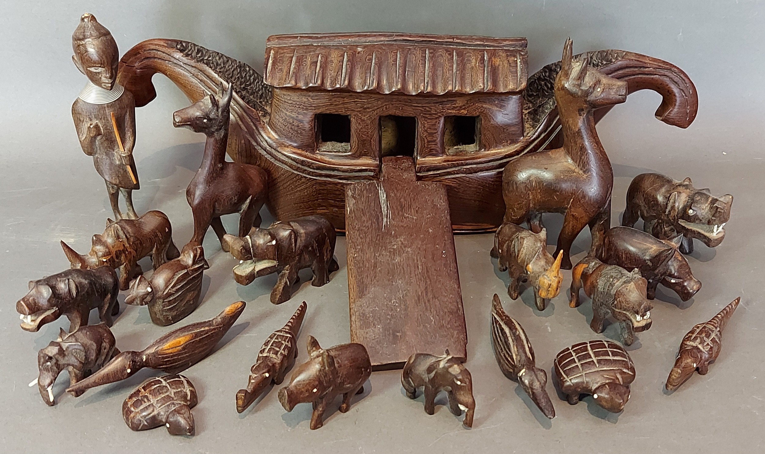 A carved hardwood model of Noah's Ark together with a collection of ...