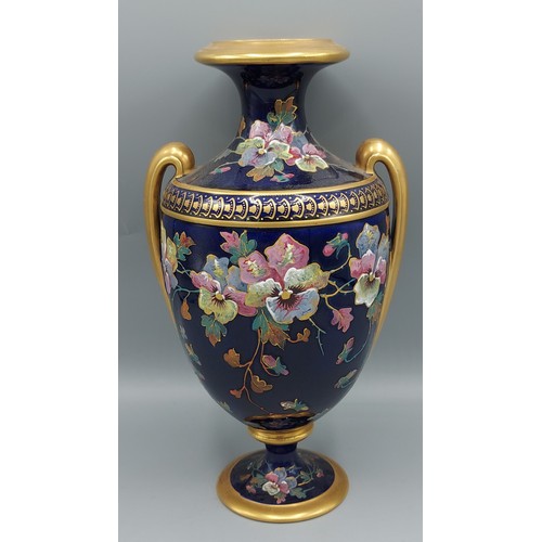 A Cauldon Ware oviform vase decorated with Pansies upon a Cobalt blue ...