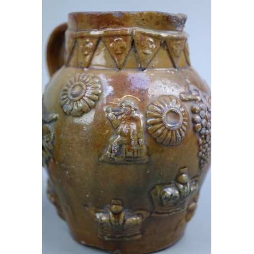 Medieval pipkin circa 1550 together with a stoneware jug