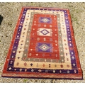 A Kayam Turkey carpet, modern, predominantly of red and cream colours ...
