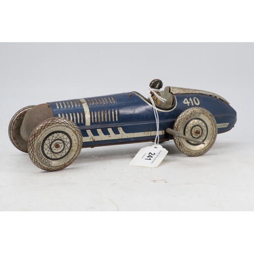 A vintage tin plate clockwork racing car