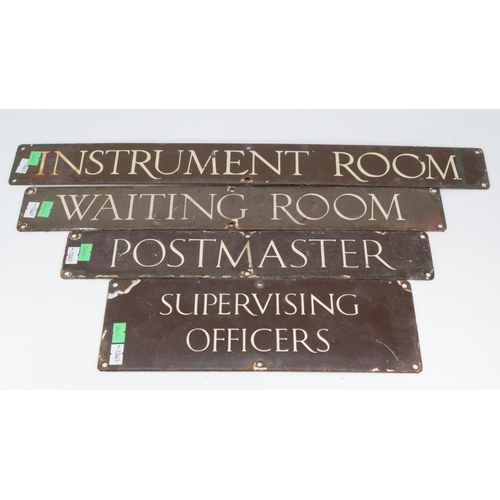 Four metal signs "Supervisors Office", "Waiting Room", "Instrument Room ...