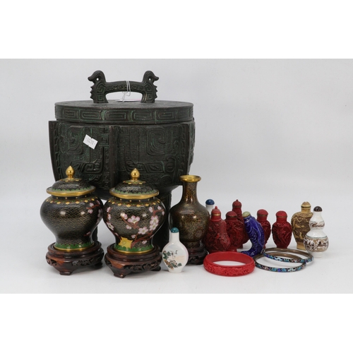 An oriental ice bucket in the form of a Koru together with a pair of ...