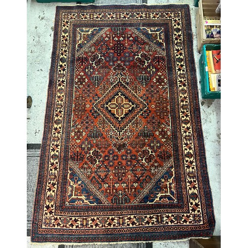 Decorative Persian rug with central lozenge, cut fringes measures ...
