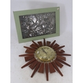 An Anstey Wilson 70s sunburst style clock together with a hammered ...