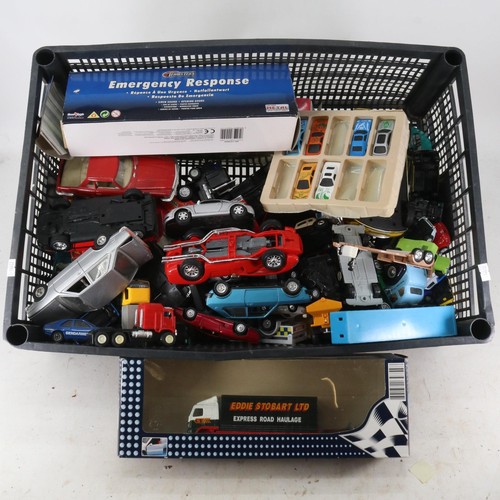A large quantity of assorted diecast and plastic vehicles