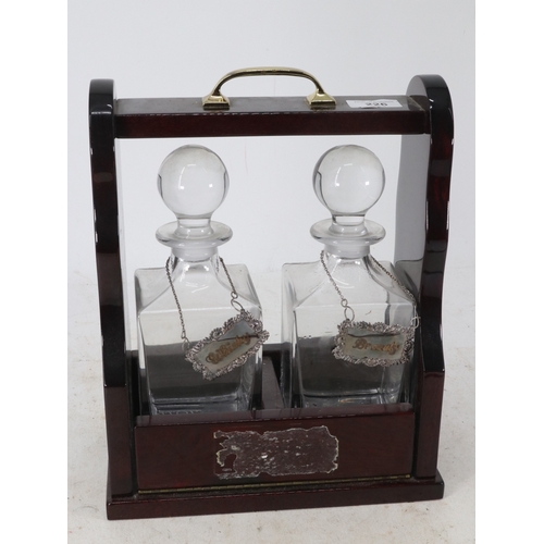 A contemporary tantalus with two decanters
