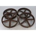 Four cast iron cart wheels measuring approx. 31cm dia.