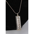 A silver ingot and chain