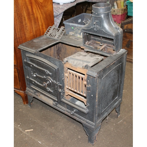 Vintage cast range? cooker together with fire stones and a quantity of ...