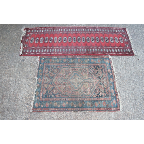 Two small Persian rugs.