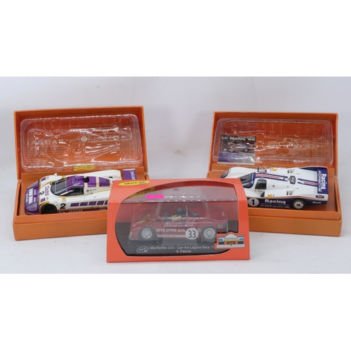 Three boxed slot it slot cars to include CA11B, CW04 limited edition Porsche, and CW03 Jaguar