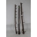 Three rustic (French?) ham / pan hooks.