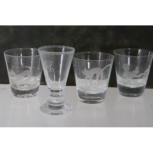 Monogrammed dram glass together with three etched glasses