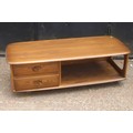 Ercol Minerva coffee table on castors. Measures approx. 124w x 54d x 41cmh