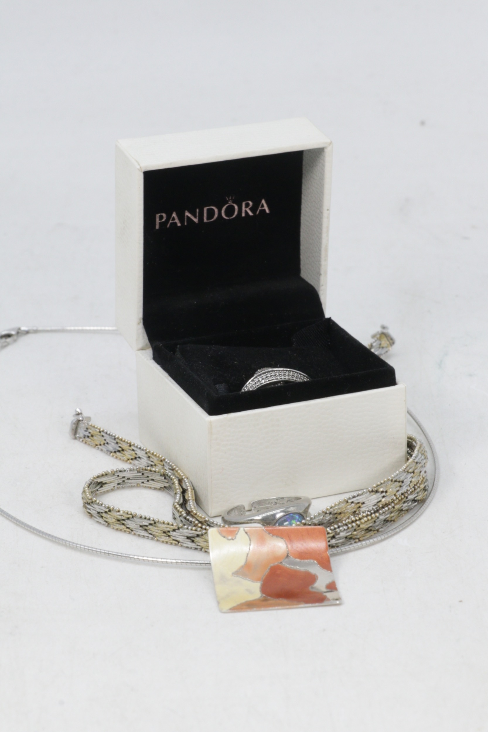 Two Pandora rings, sterling wire necklace and pendant, and 835 marked ring and necklace and bracelet