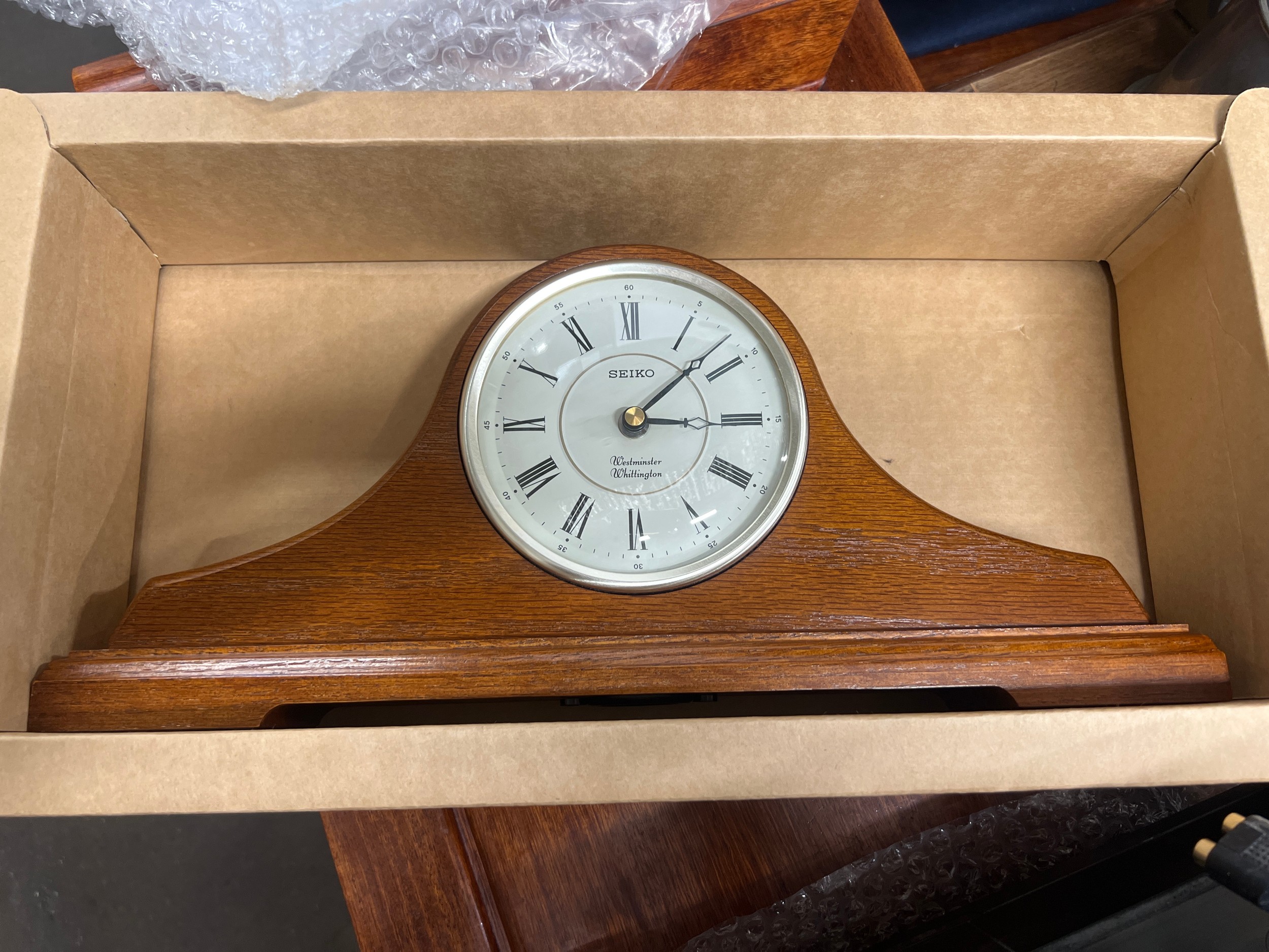 Seiko Westminster Whittington mantle clock together with an Olympus camera