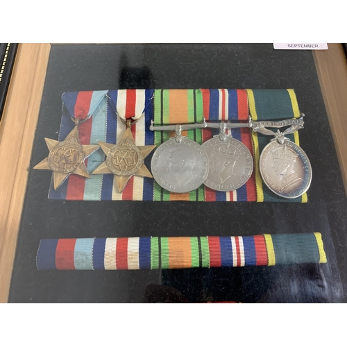 A framed selection of WW2 medals including The Territorial Medal, note ...