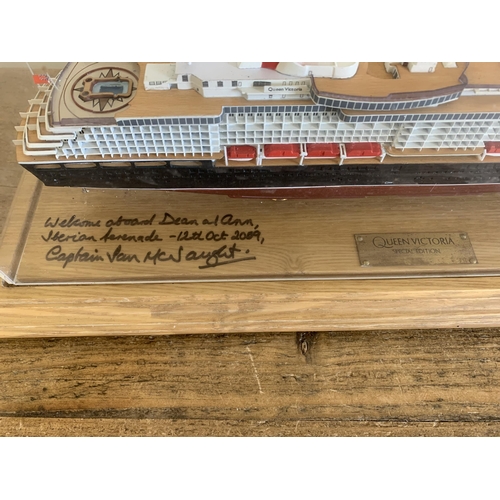 A wood cased chiming mantel clock plus a cased model of the Cunard ...