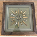 A glazed case display of various inert bullets for handguns and rifles ...