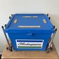 A Shakespeare tackle box with octopus legs and a small box of terminal ...