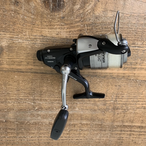 A Shimano 6000DC bait runner fishing reel in box with line