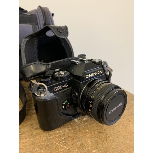 A Chinon CE-4 35mm camera together with bag and accessories plus a ...