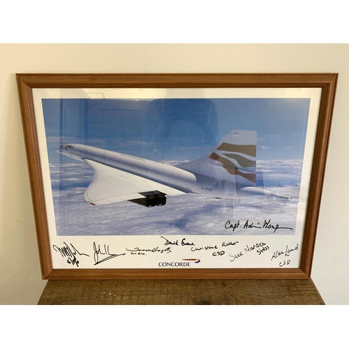 A large framed and glazed print of Concorde, signed by various ...