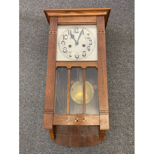 A vintage wood cased key wind wall clock with pendulum and key, approx ...