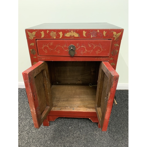 A small vintage Oriental cupboard, wood carcass with red background and ...