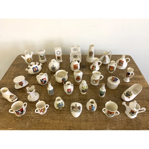 A selection of mixed maker crested ware china