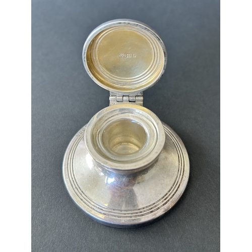 A small hallmarked silver Capstan inkwell with glass liner plus a ...
