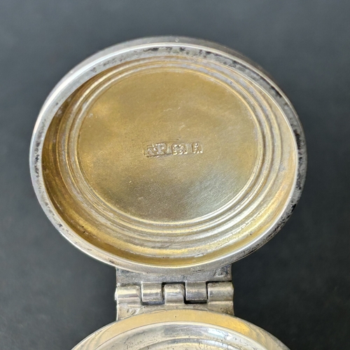 A small hallmarked silver Capstan inkwell with glass liner plus a ...