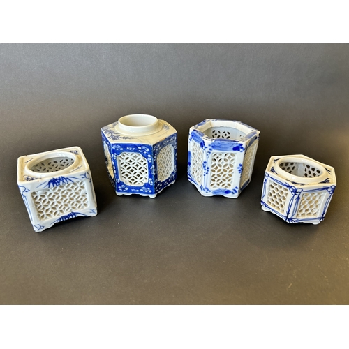 Four vintage Chinese reticulated pots of various sizes, the largest an ...