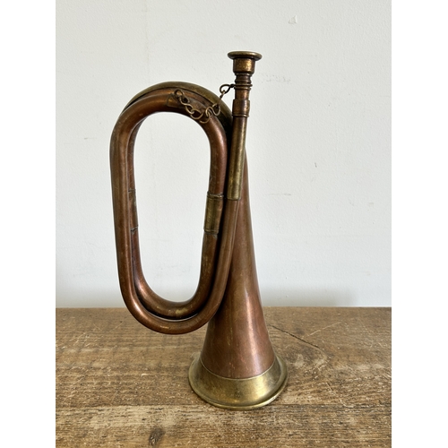 A copper and brass military bugle