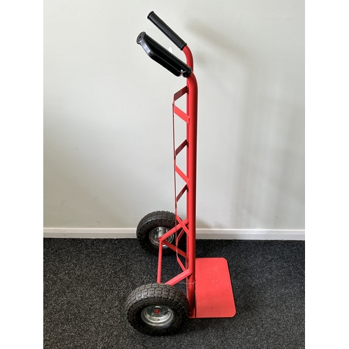 A red sack barrow, 46" high x 21" wide