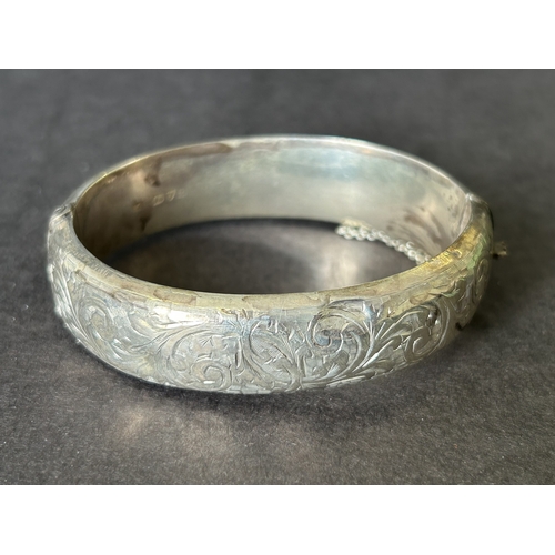 A Chester hallmarked silver bangle plus a white metal locket on 925 ...