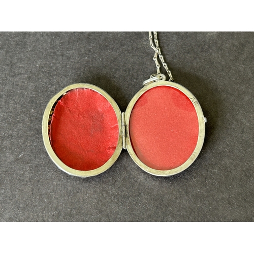 A Chester hallmarked silver bangle plus a white metal locket on 925 ...