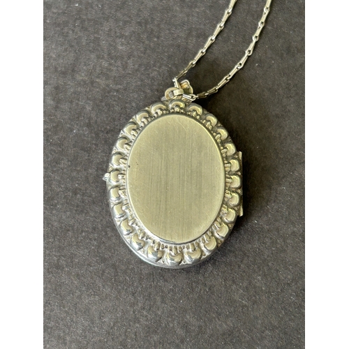 A Chester hallmarked silver bangle plus a white metal locket on 925 ...