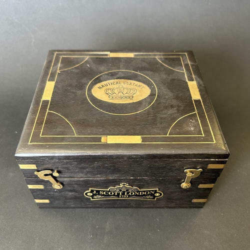 A wooden boxed J Scott of London nautical style sextant