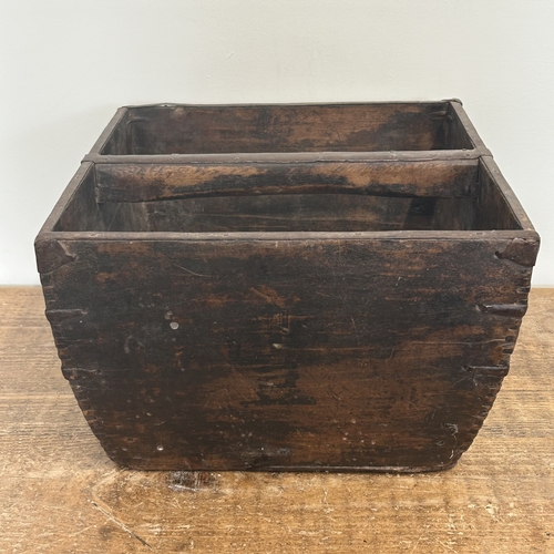 An antique Oriental solid wood basket with metal strap fittings, 13" x ...