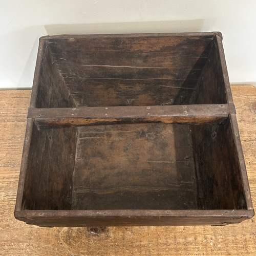 An antique Oriental solid wood basket with metal strap fittings, 13" x ...