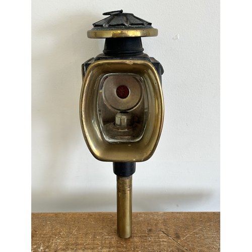 An antique brass and painted metal coach lamp, approx. 17" long