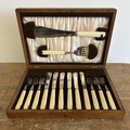 A wood cased Mappin & Webb A1 silver plated fish eaters with servers