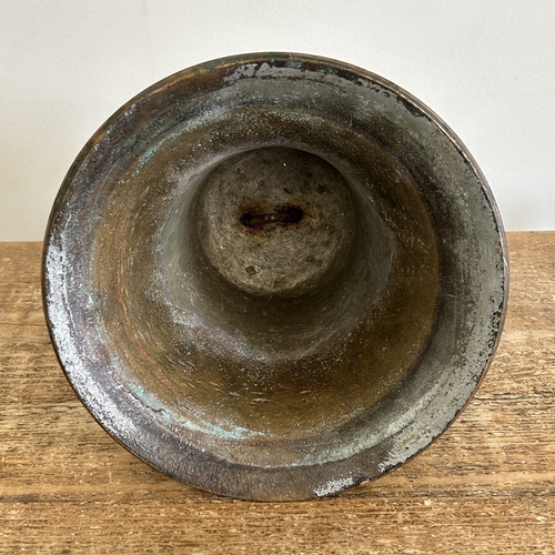 A solid and heavy metal ships bell, approx. 9" high (no clapper)